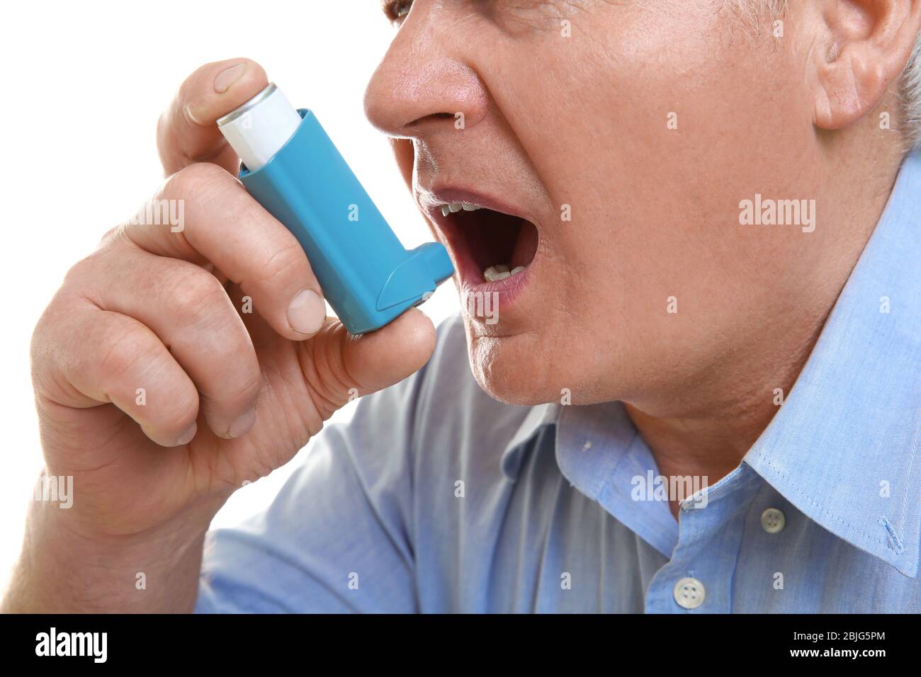 Elderly man using inhaler, closeup Stock Photo - Alamy