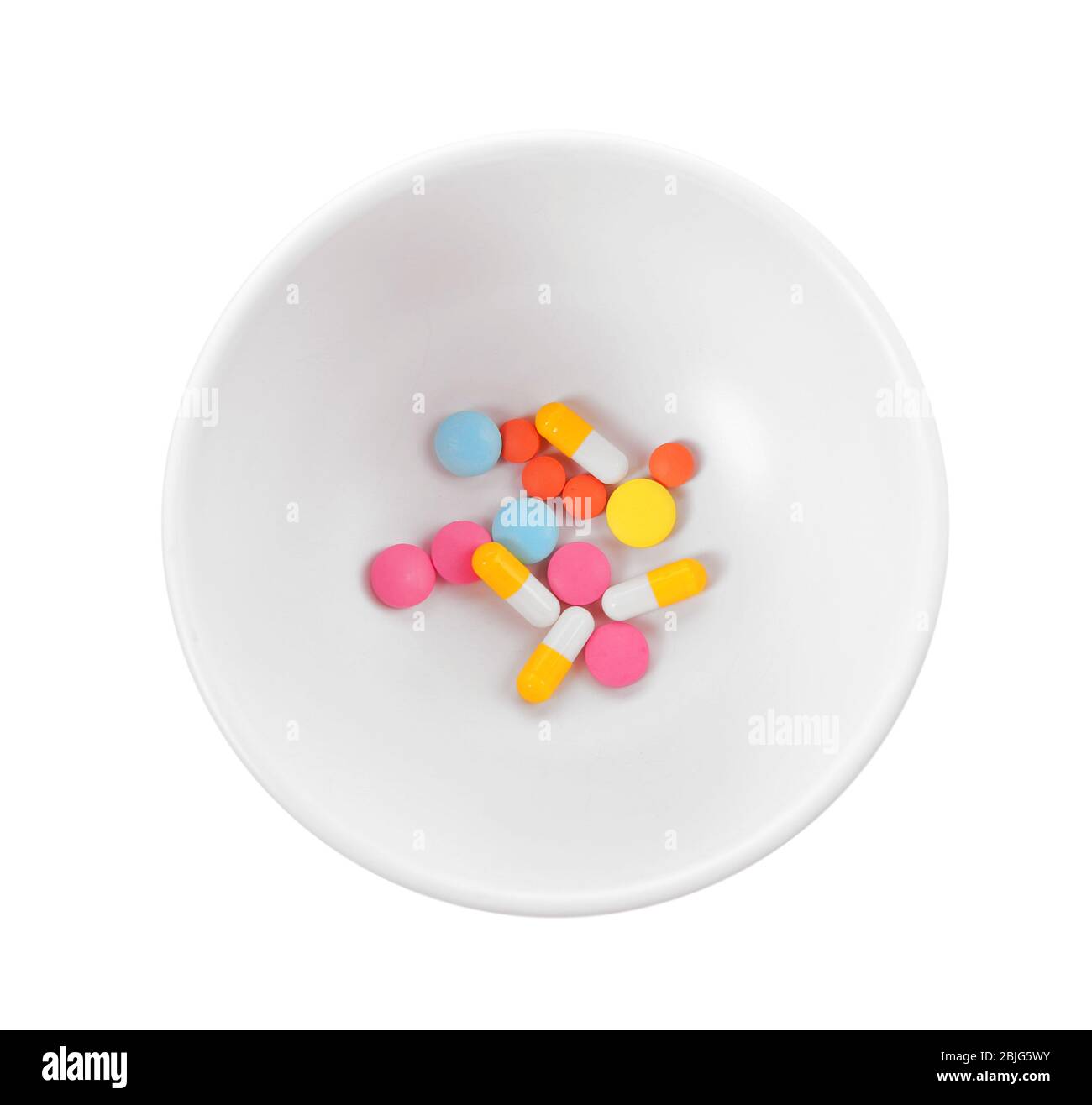 Diet concept. Bowl with colorful assorted pills on white background ...