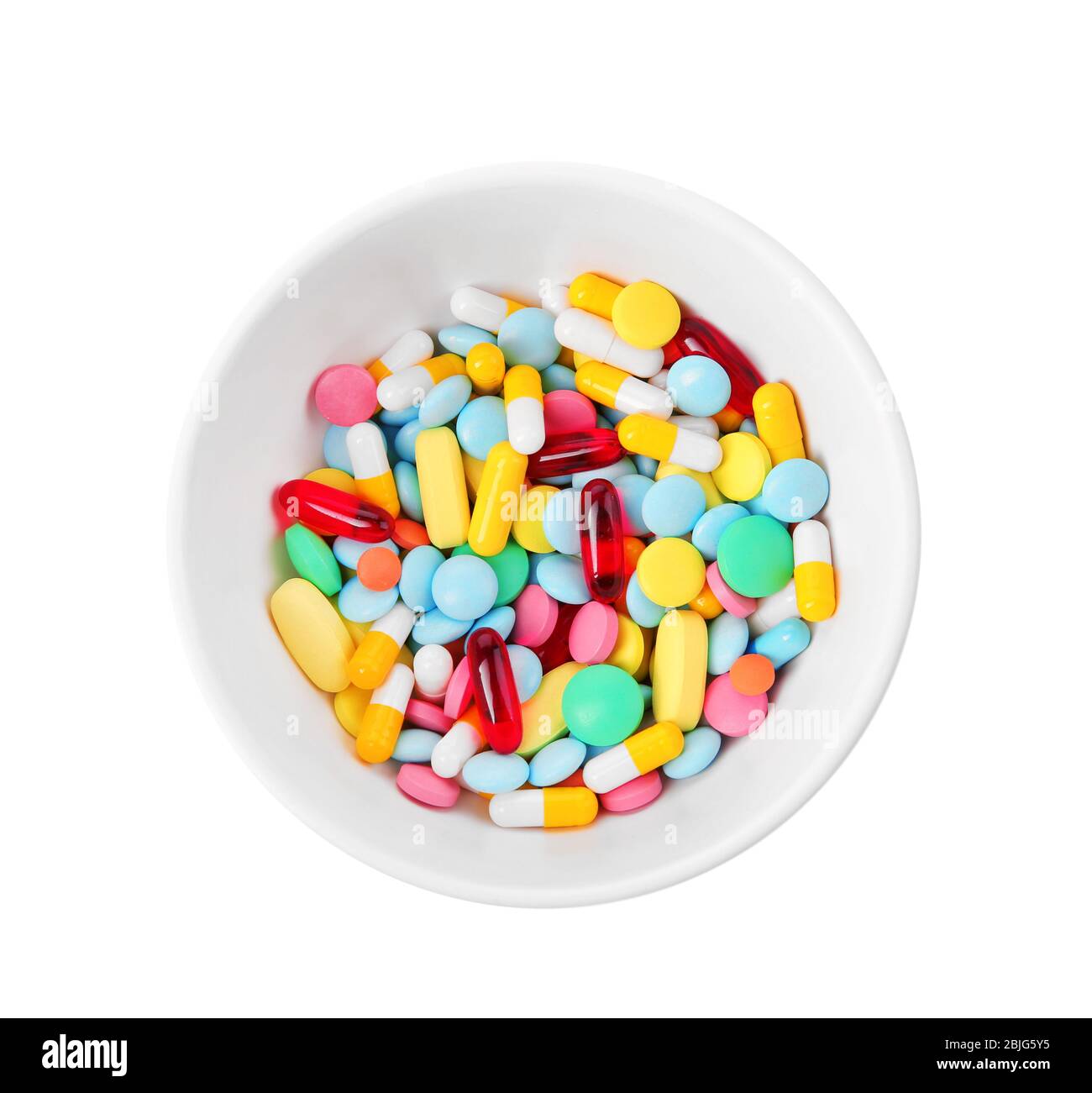Diet concept. Bowl with colorful assorted pills on white background ...