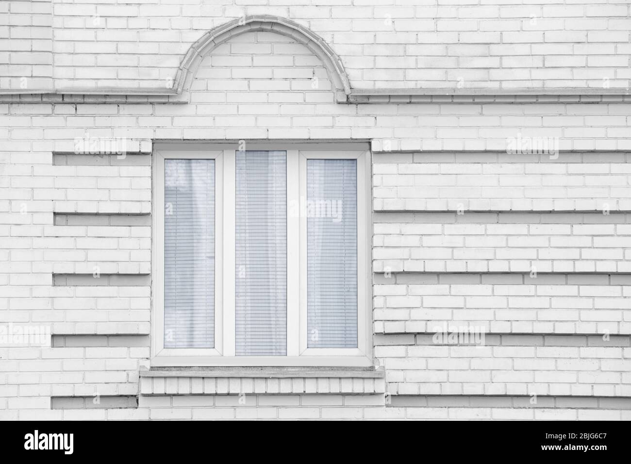 Building with white plastic window Stock Photo - Alamy
