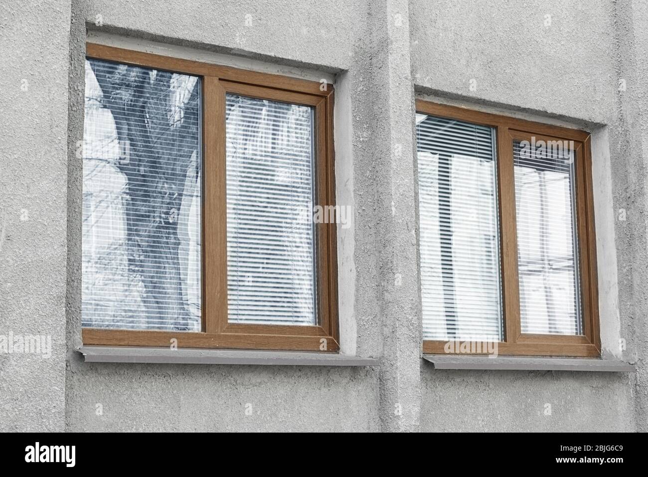Building with modern plastic windows Stock Photo - Alamy