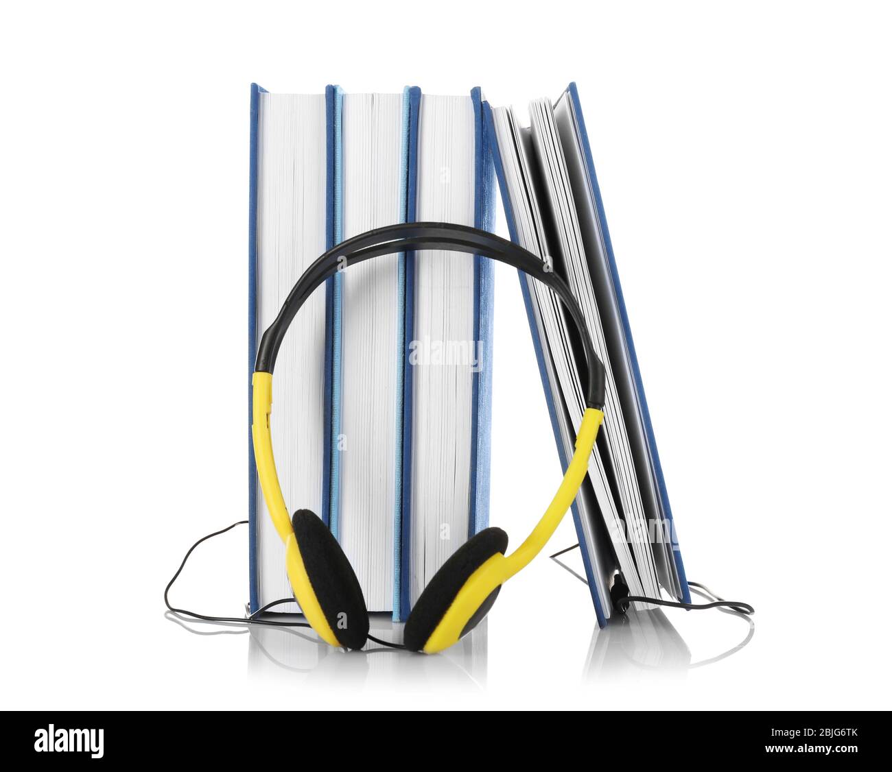 Audiobook concept. Pile of books and headphones on white background ...