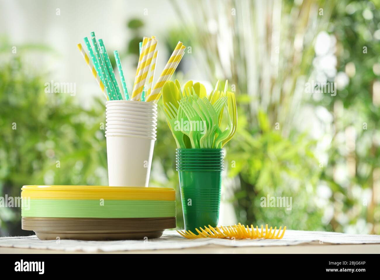 Plastic ware on table outdoors Stock Photo - Alamy