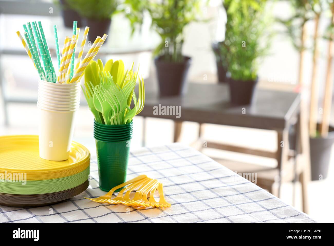 Plastic ware on table outdoors Stock Photo - Alamy
