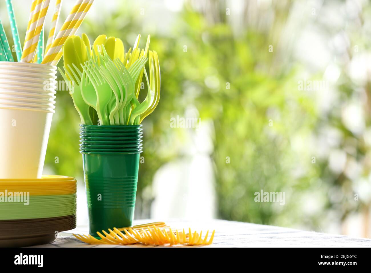 Plastic ware on table outdoors Stock Photo - Alamy