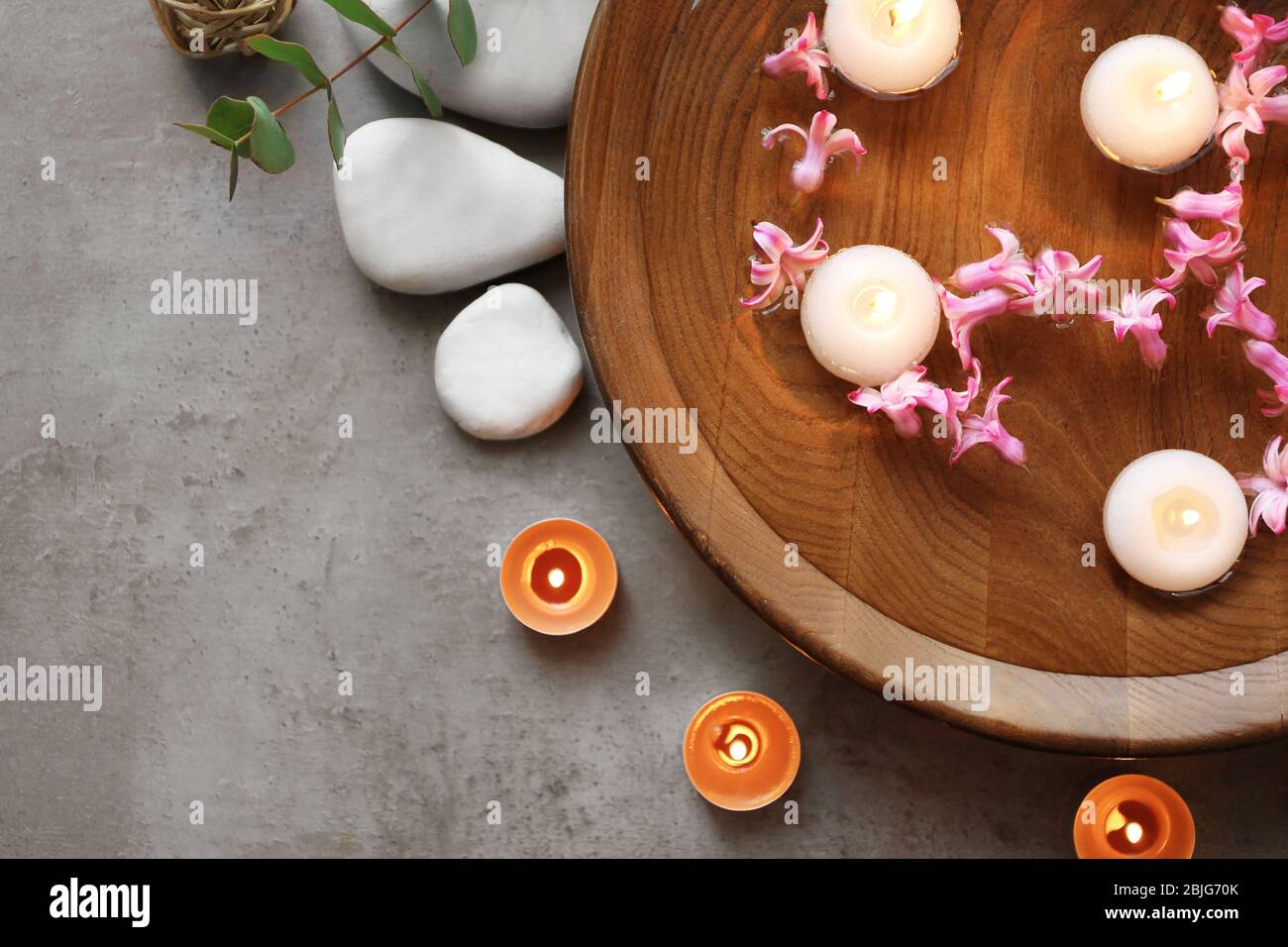 Beautiful spa composition with flowers and candles on water Stock Photo ...