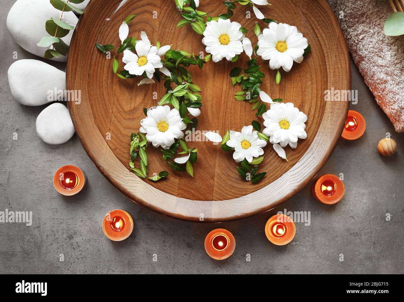 Beautiful spa composition with flowers on water Stock Photo - Alamy