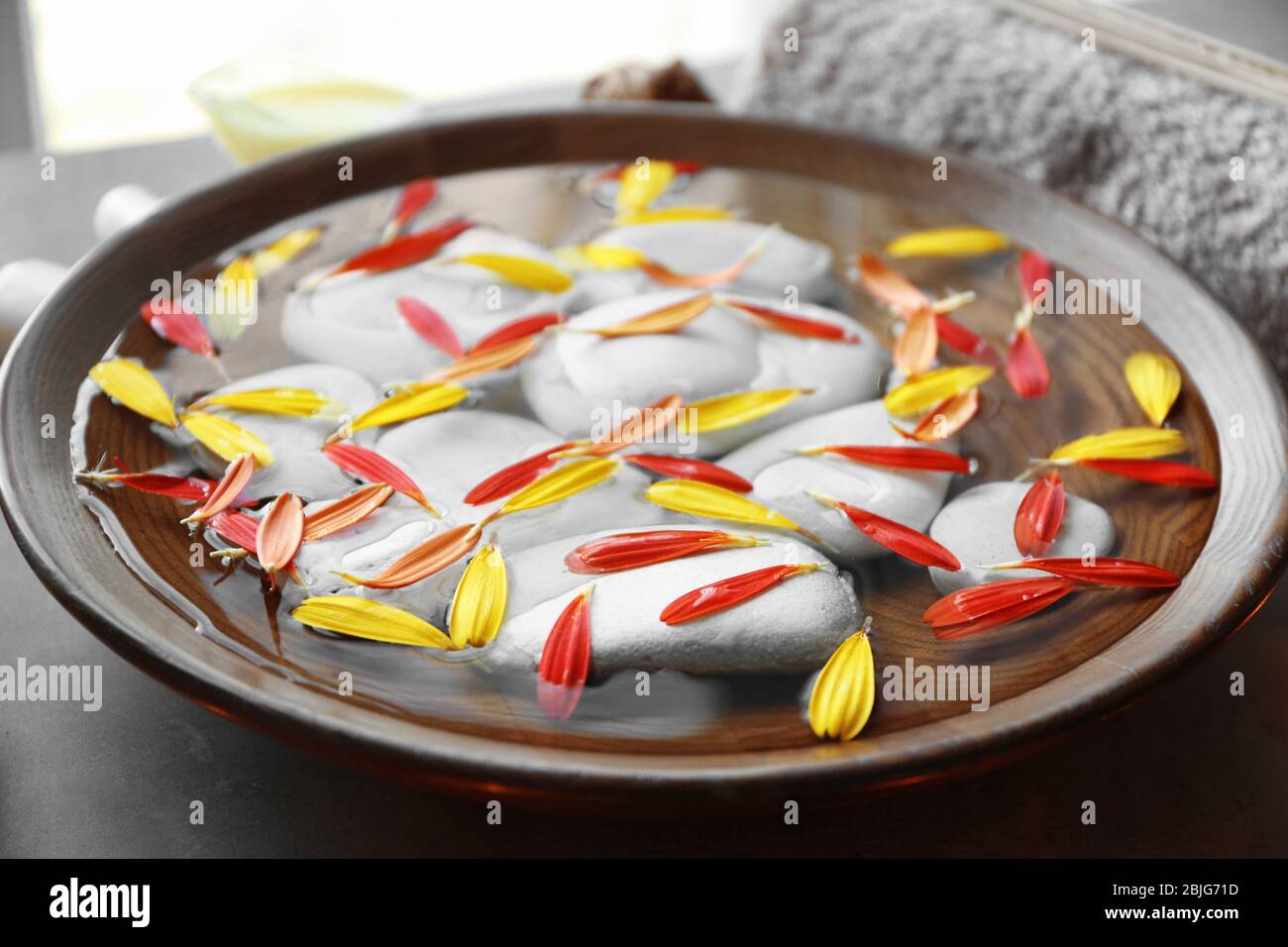 Beautiful spa composition with flower petals on water Stock Photo - Alamy