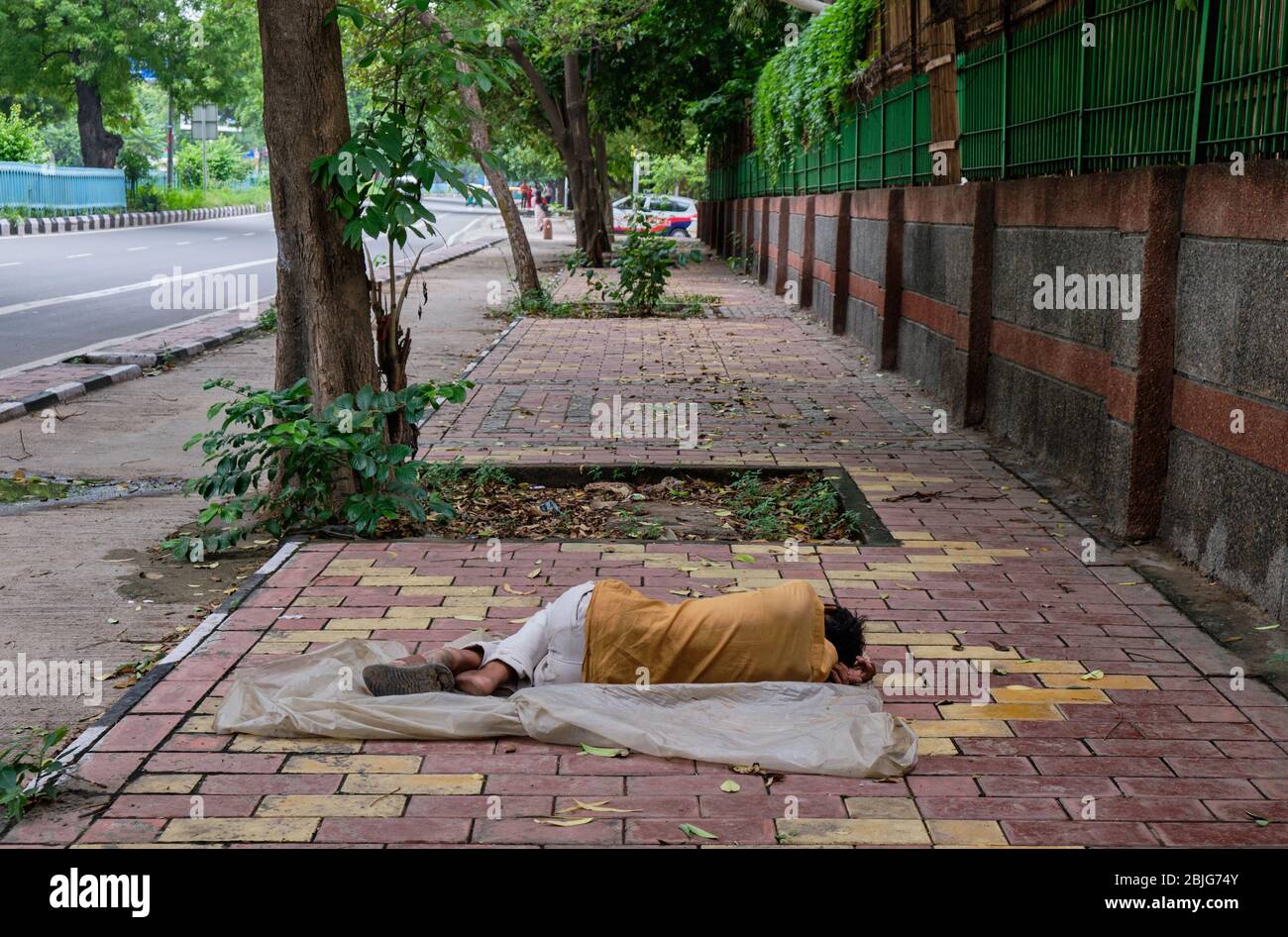 Homeless Indian Man Sleeping On High Resolution Stock Photography and ...
