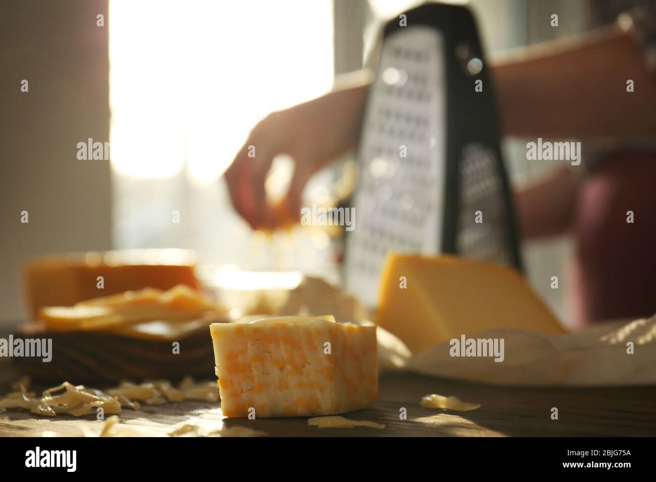 Woman eating cheddar cheese hi-res stock photography and images - Alamy