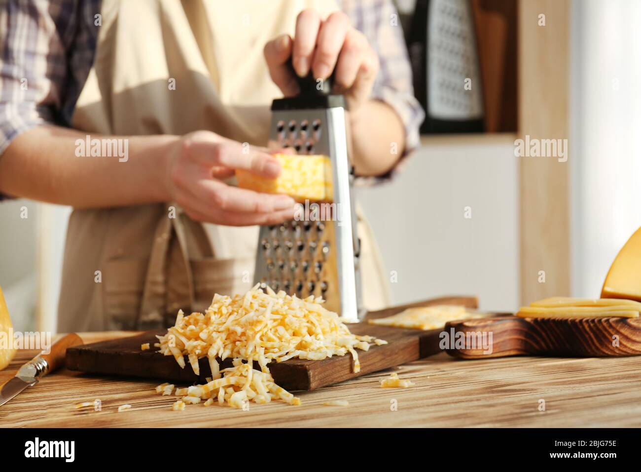 Woman eating cheddar cheese hi-res stock photography and images - Alamy