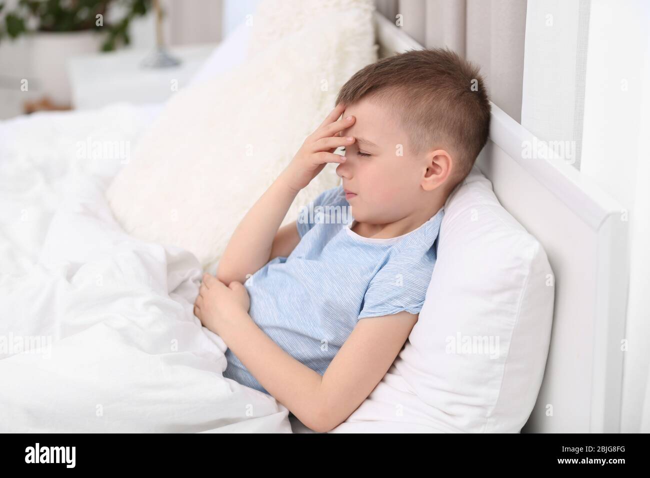 Headaches in children hi-res stock photography and images - Alamy