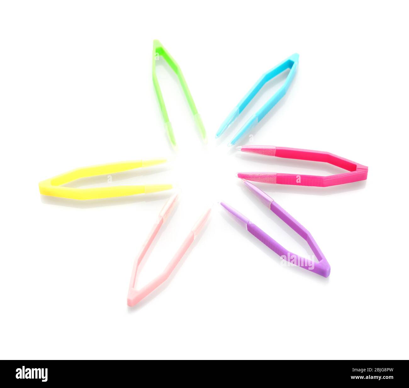 Color tweezers on white background Stock Photo - Alamy