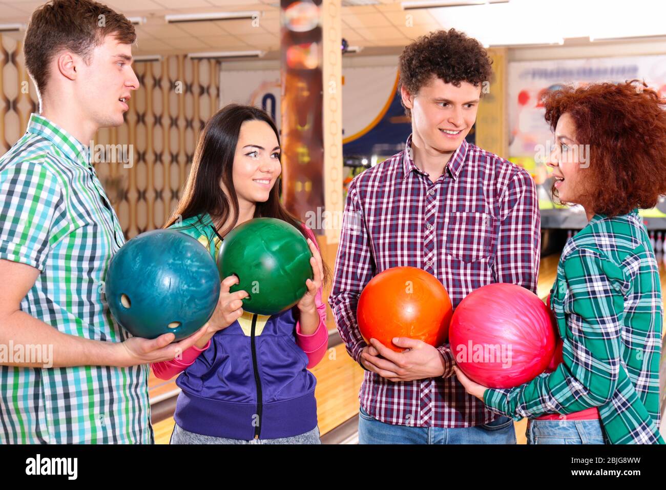 Friends having fun in bowling Stock Photo - Alamy