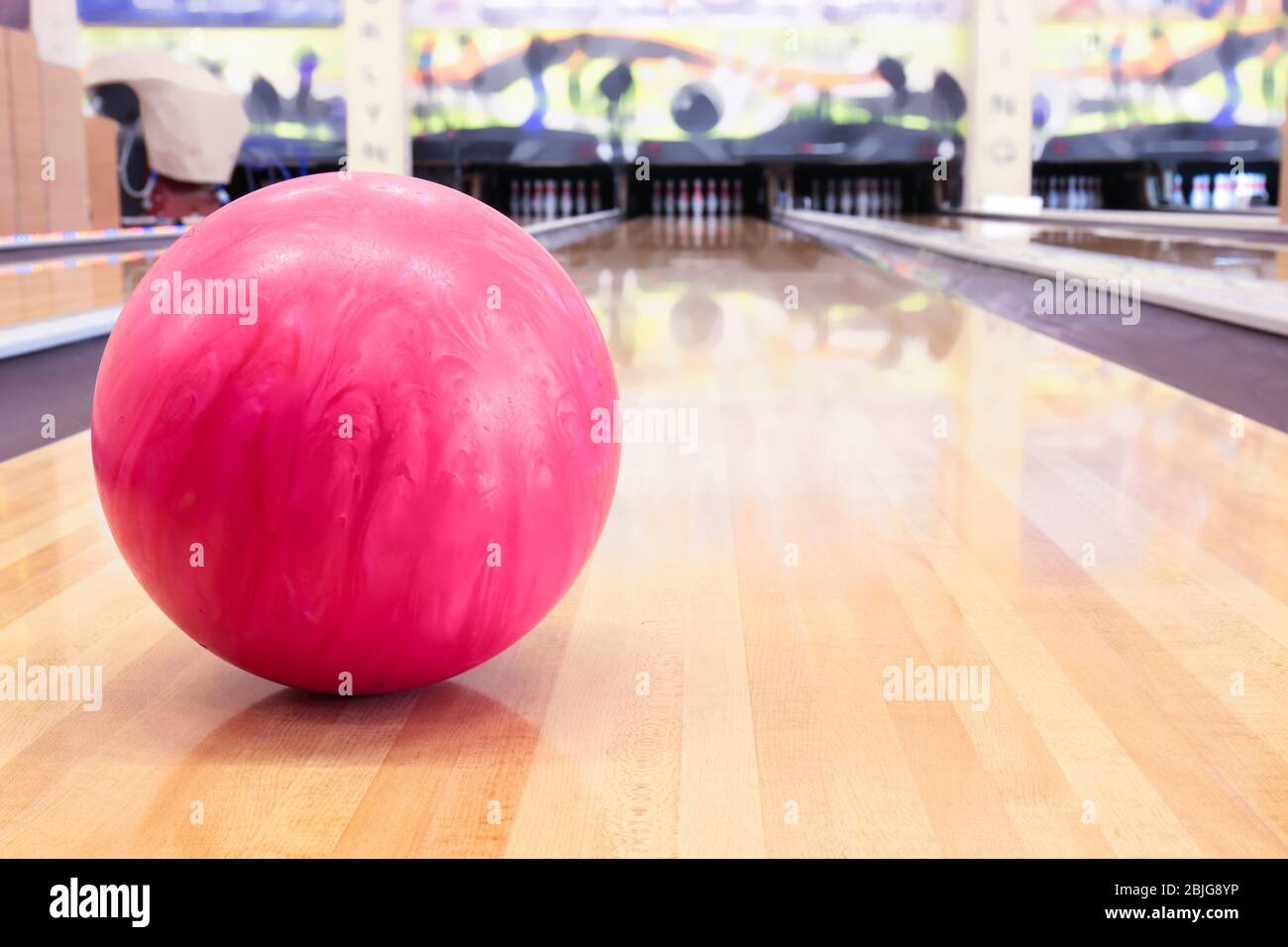 Pink ball on floor in bowling club Stock Photo - Alamy