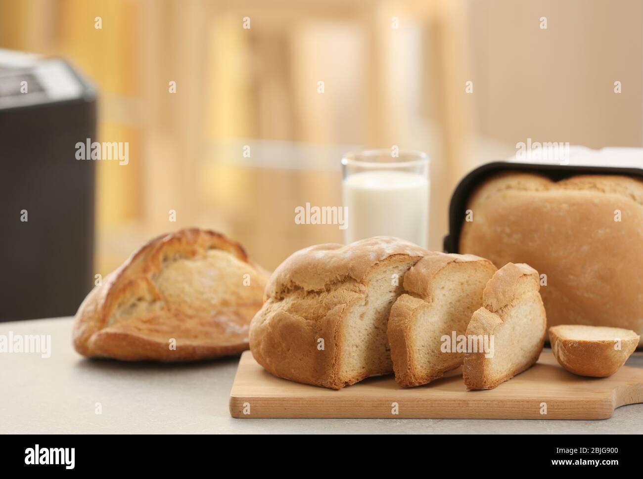 Tasty sliced loaf on table Stock Photo - Alamy