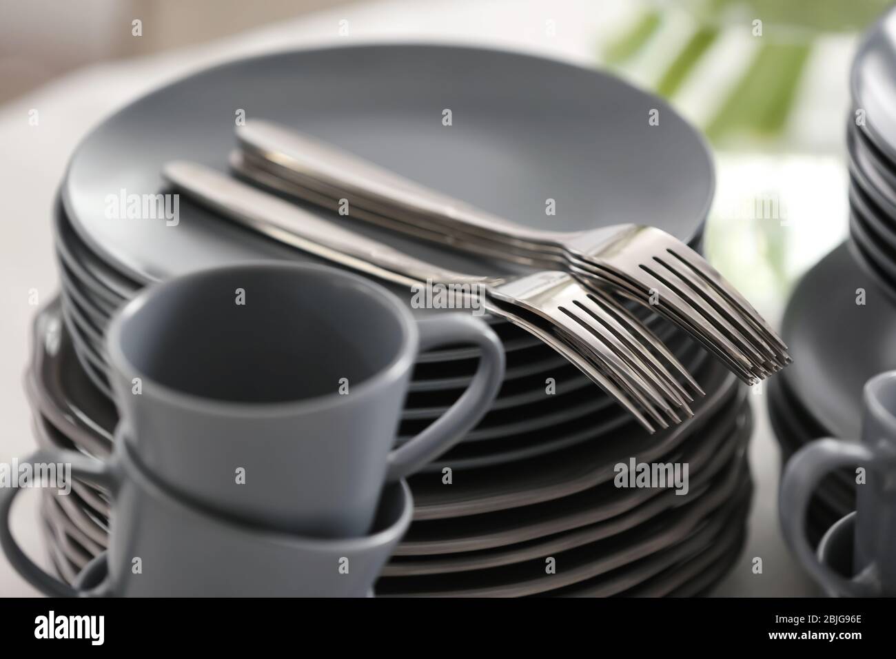 Set of dishware on table in restaurant, closeup Stock Photo - Alamy