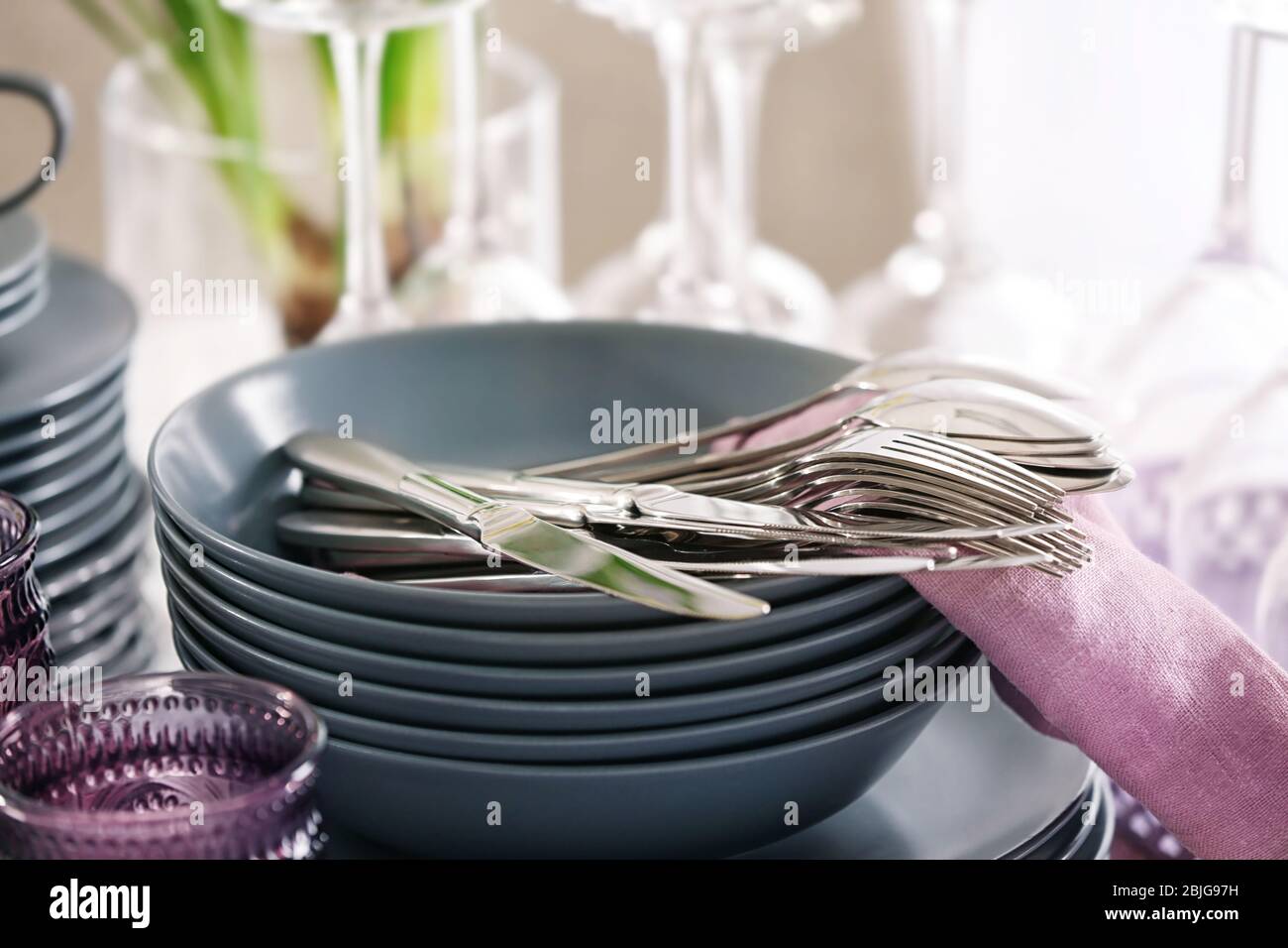 Set of dishware on table in restaurant Stock Photo - Alamy
