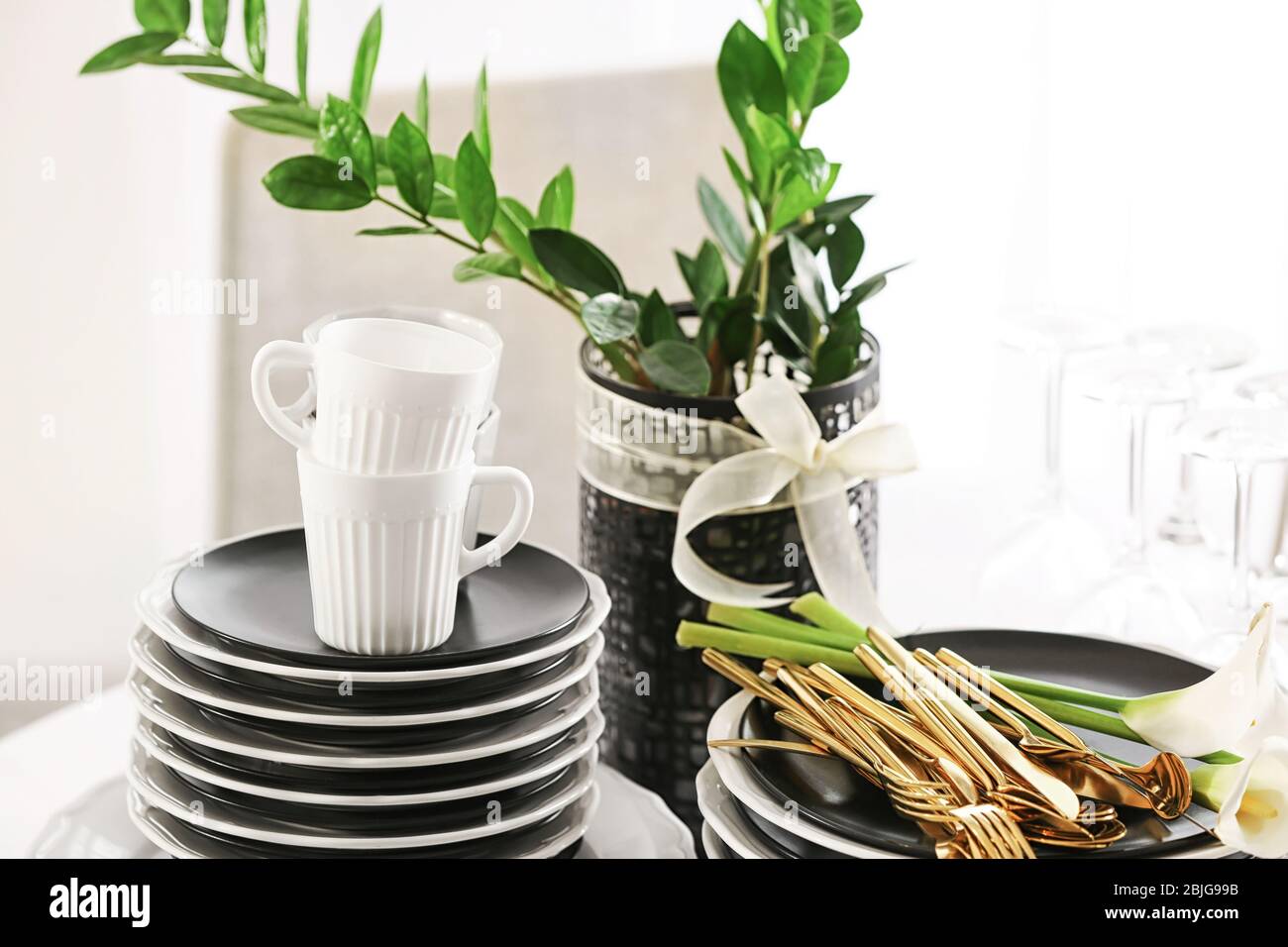 Set of dishware on table in restaurant Stock Photo - Alamy