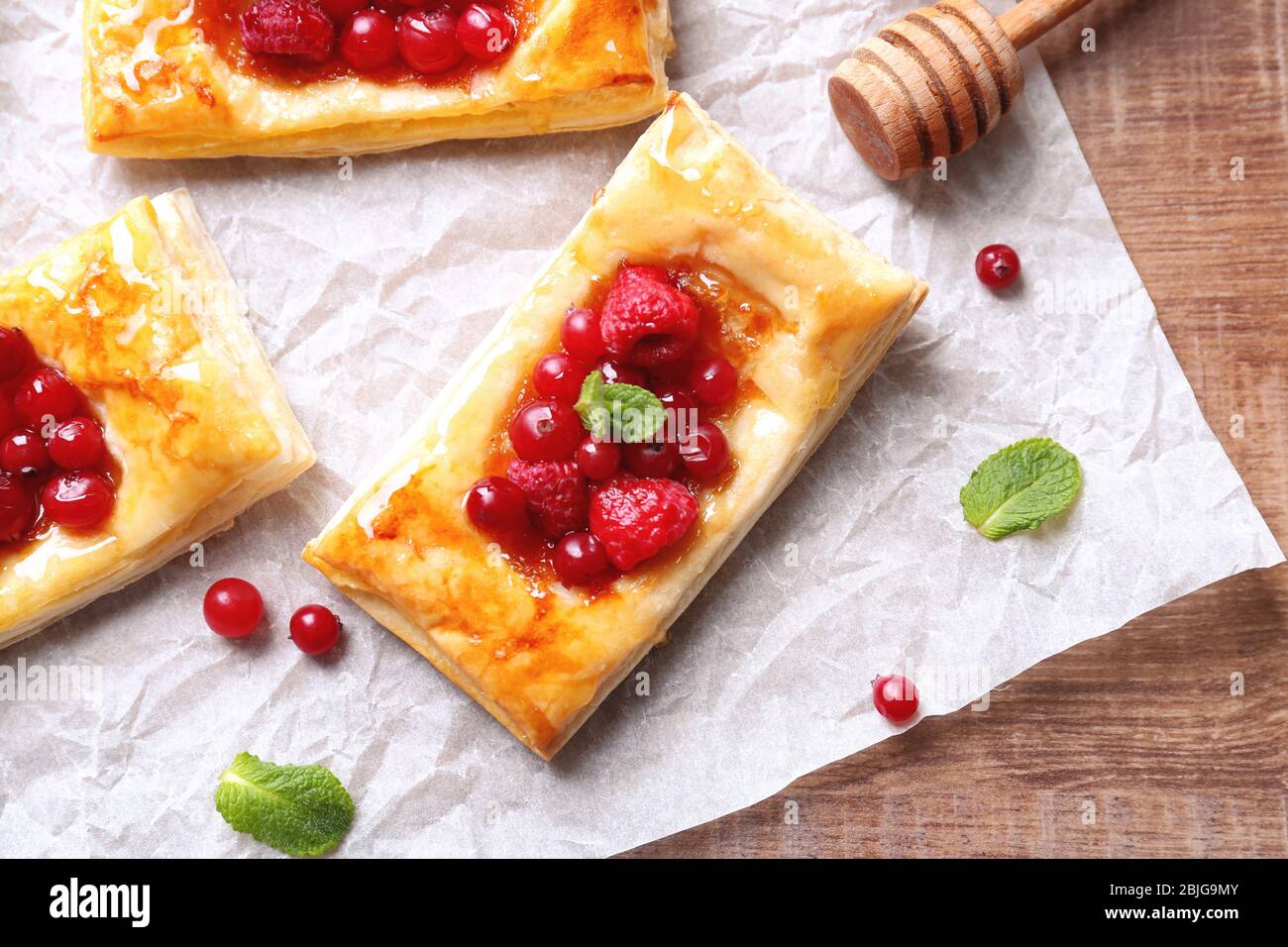Delicious pastries on food paper, closeup Stock Photo - Alamy