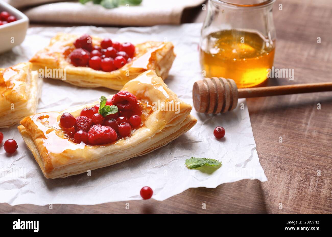 Delicious pastries on food paper, closeup Stock Photo - Alamy