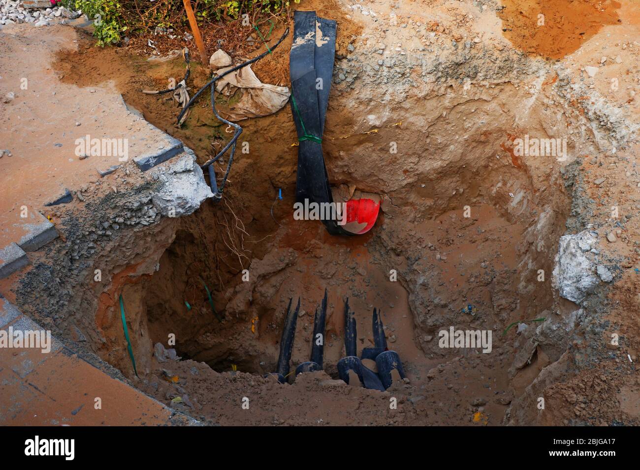 deep excavation near the foot path due to underground cable work Stock ...