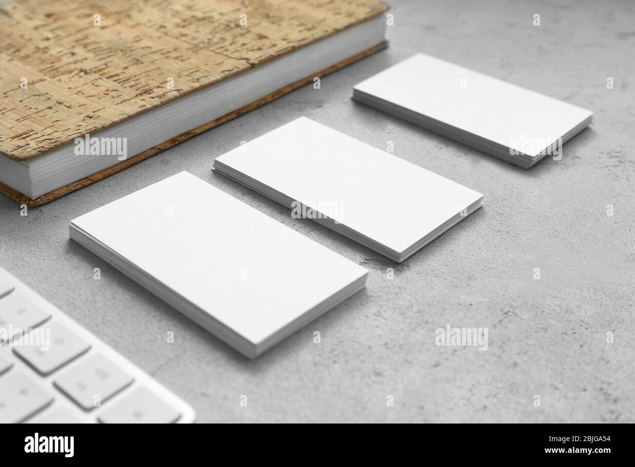 Piles of business cards on grey table Stock Photo - Alamy