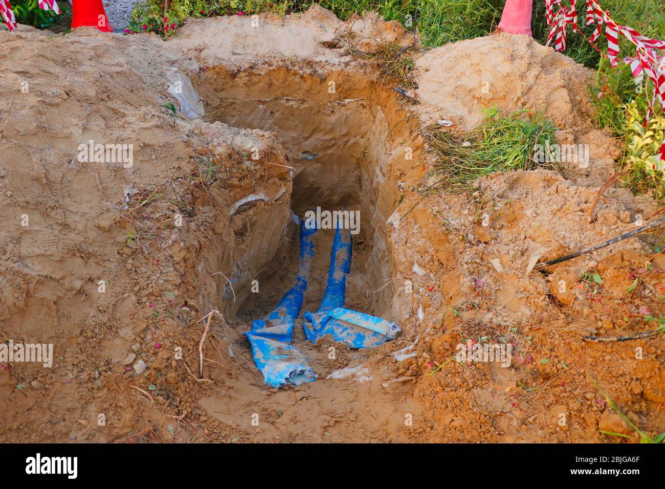 deep excavation near the foot path, part of construction work Stock ...
