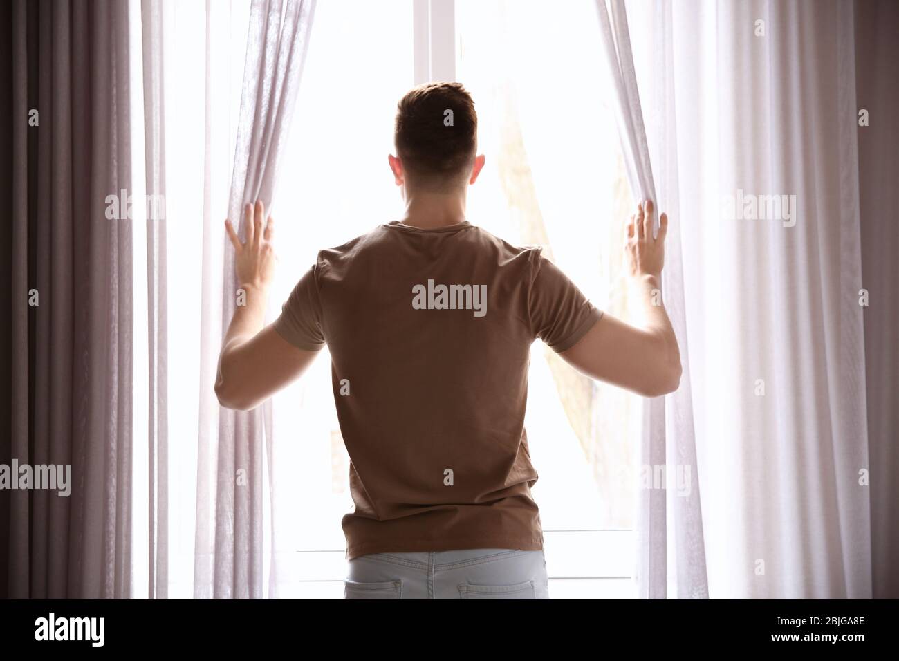 Man Opening Curtains High Resolution Stock Photography and Images - Alamy