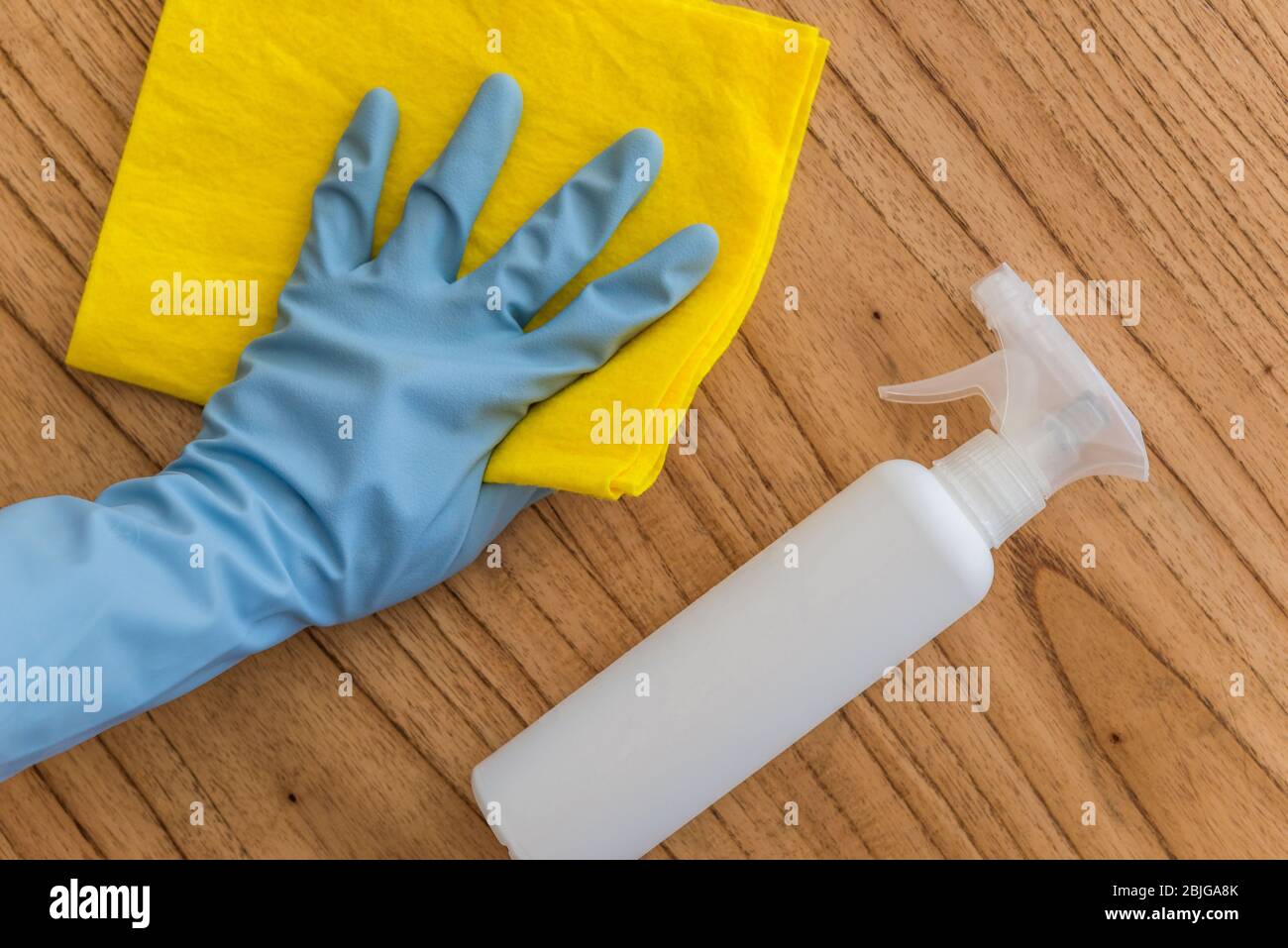 Disinfecting a table surface with rubbing alcohol for prevention of ...