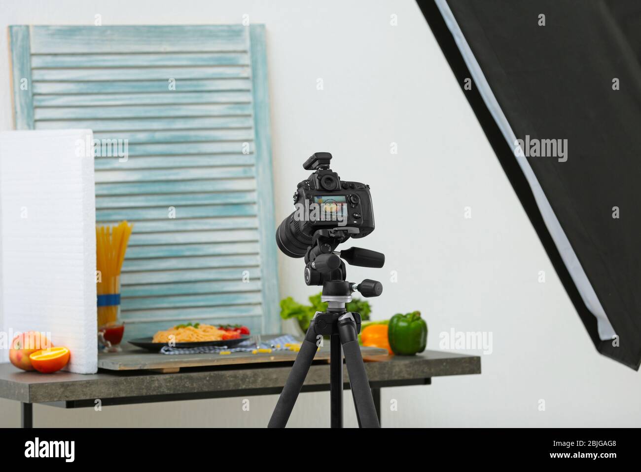 Professional camera on tripod while shooting food Stock Photo - Alamy