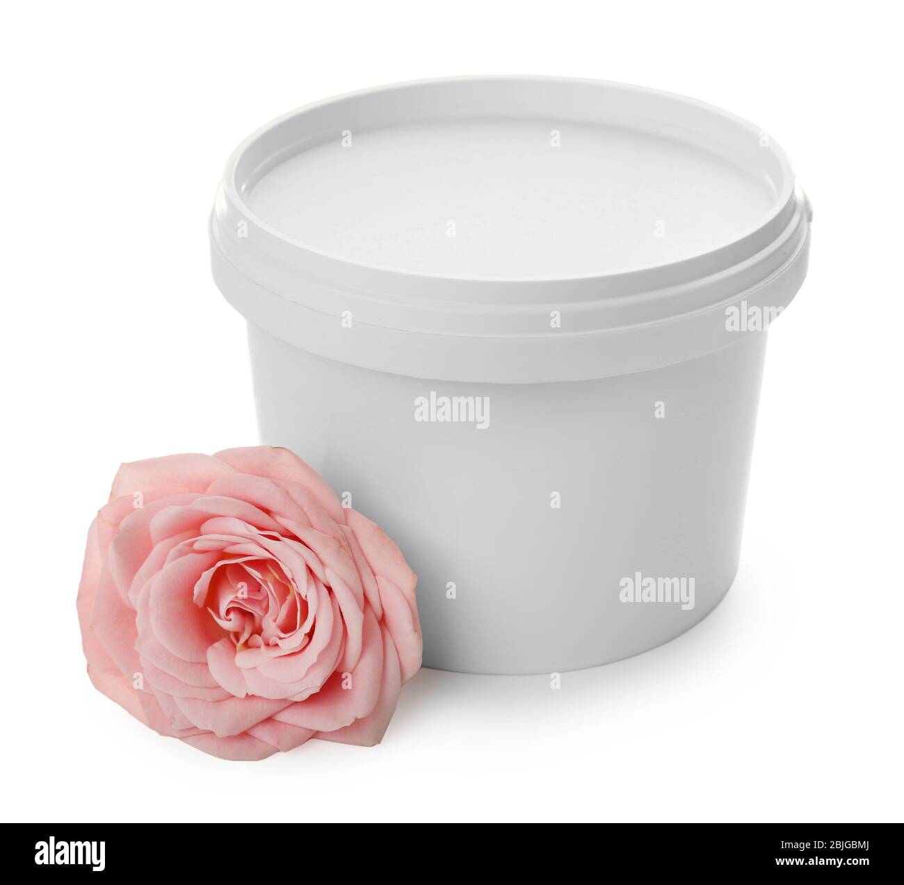 Plastic bucket with sugaring paste and flower on white background Stock ...