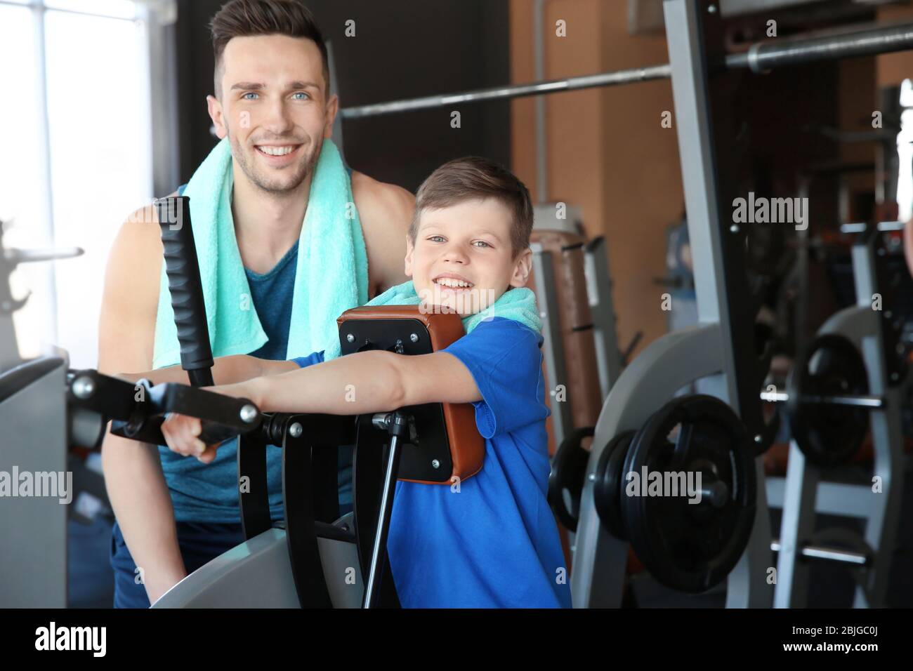 Dad and son training in gym Stock Photo - Alamy