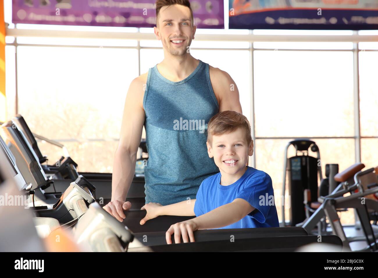 Dad and son in gym Stock Photo - Alamy