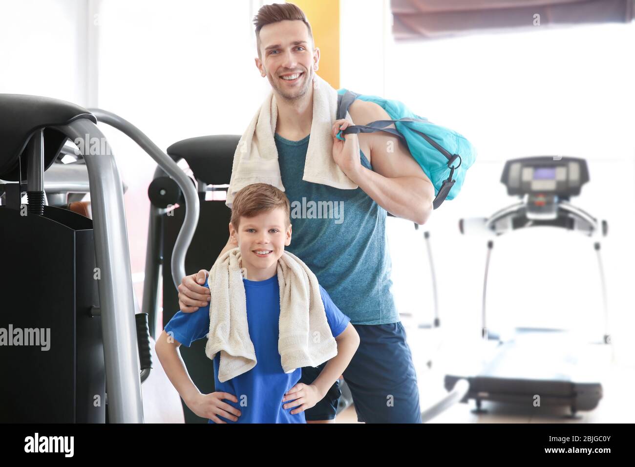 Dad and son spending time in gym Stock Photo - Alamy