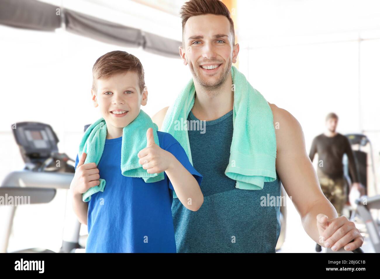 Dad and son in gym Stock Photo - Alamy