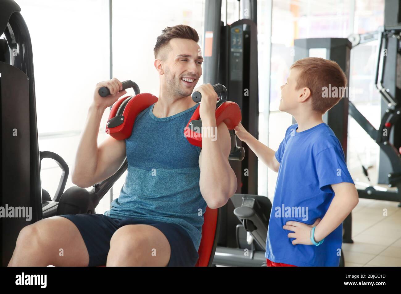 Dad and son training in gym Stock Photo - Alamy
