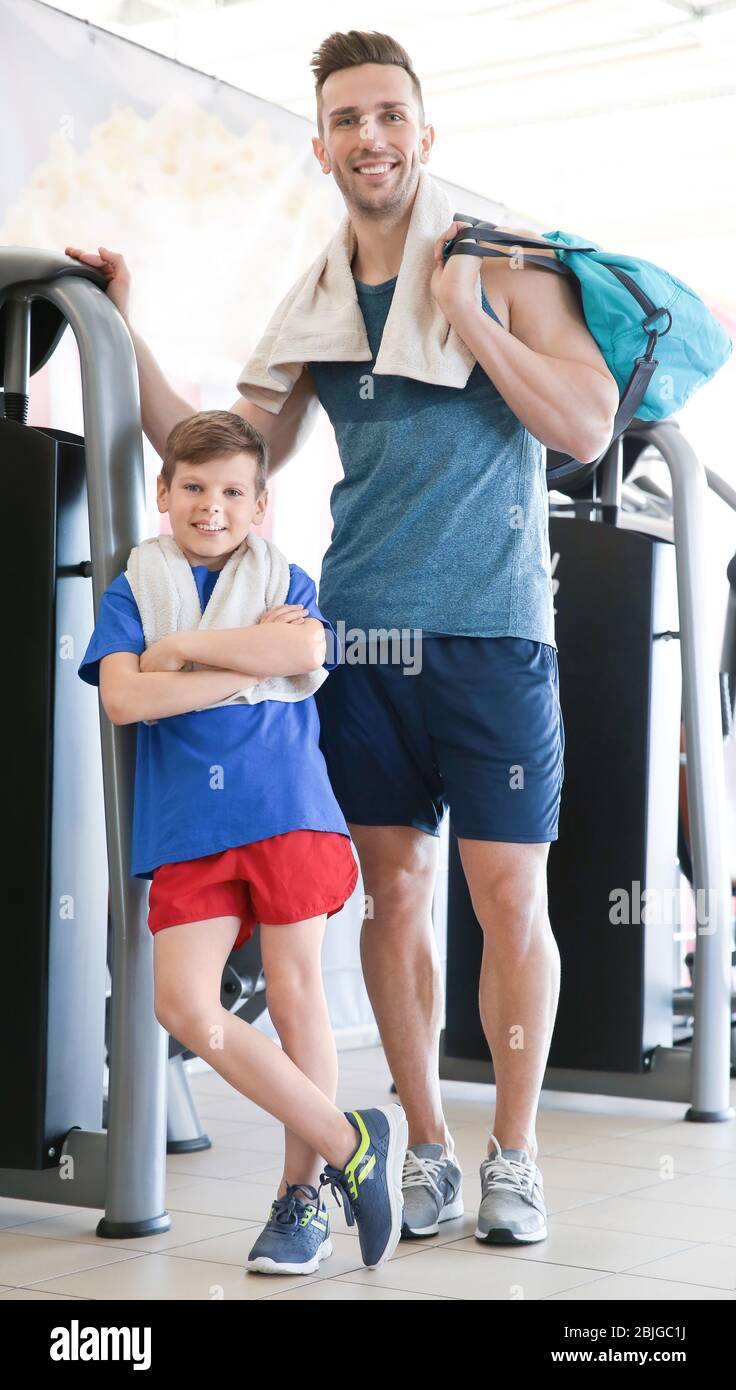 Dad and son spending time in gym Stock Photo - Alamy