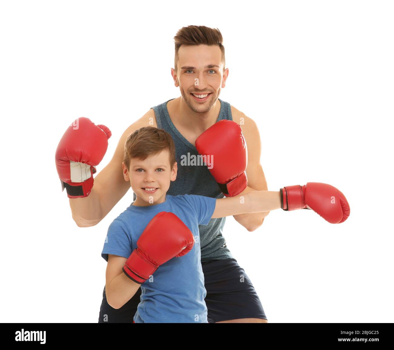 Dad and son in boxing gloves on white background Stock Photo - Alamy