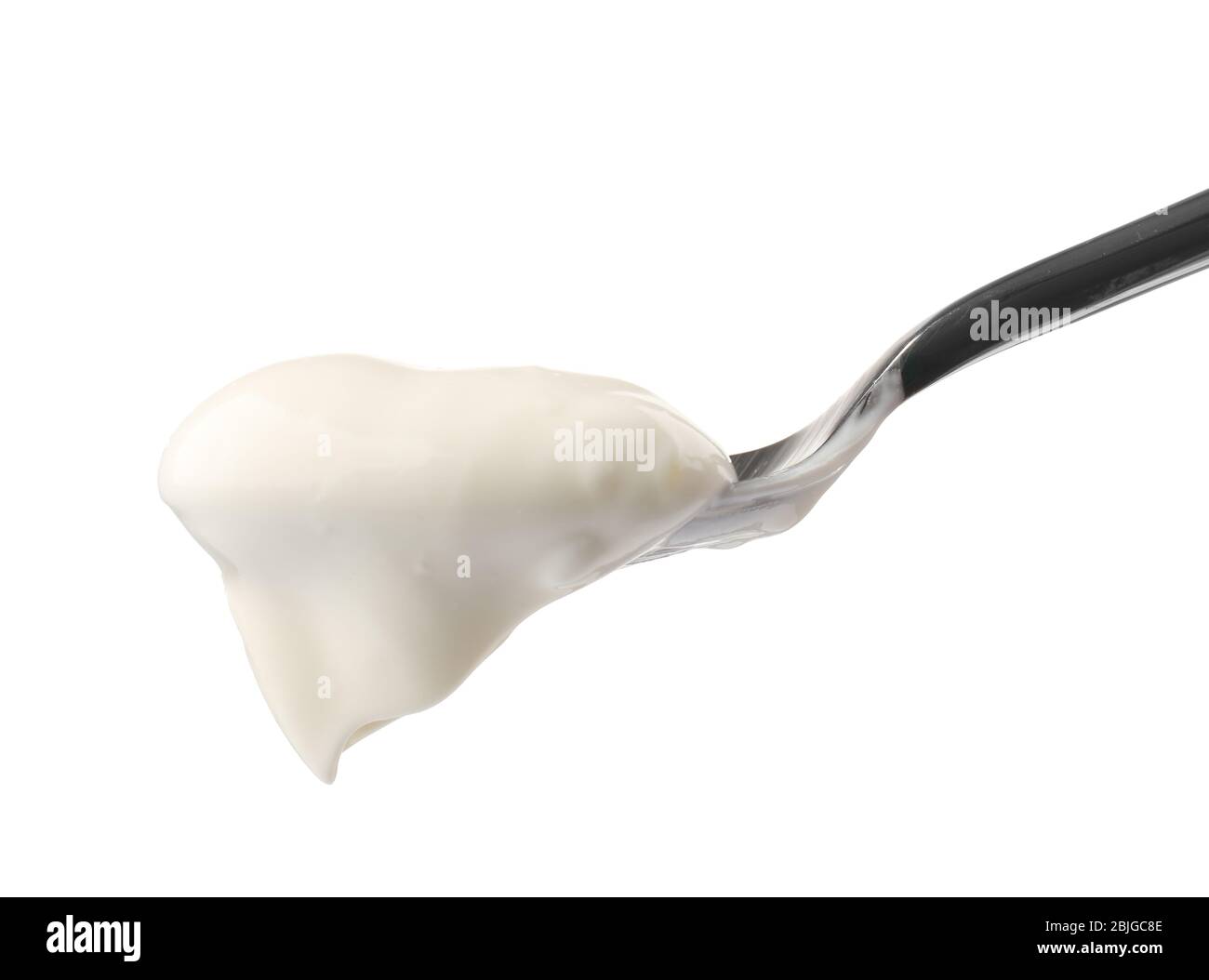Spoon with delicious yogurt on white background Stock Photo - Alamy