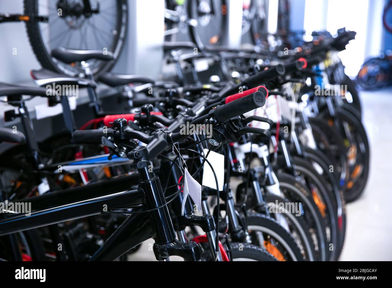 Modern new bicycles in shop Stock Photo - Alamy