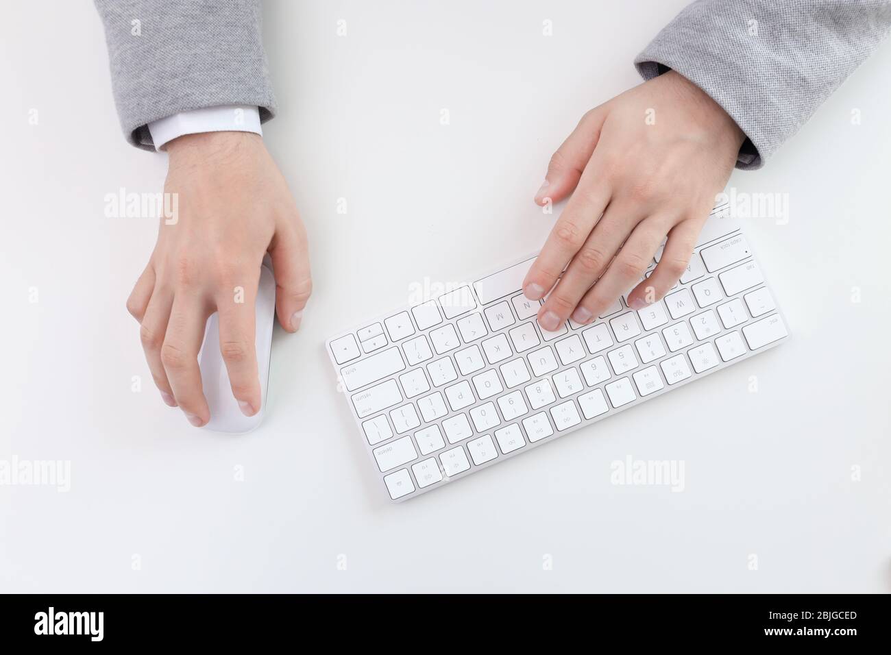 Male hands with computer mouse and keyboard on white background Stock ...