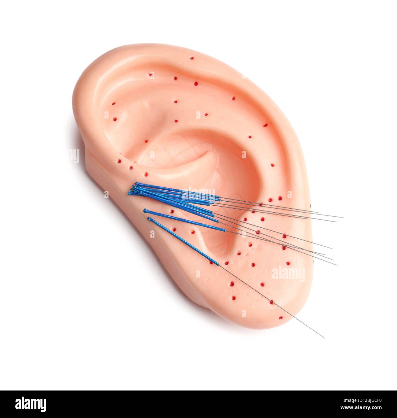 Needles for acupuncture and plastic mockup of human ear on white ...