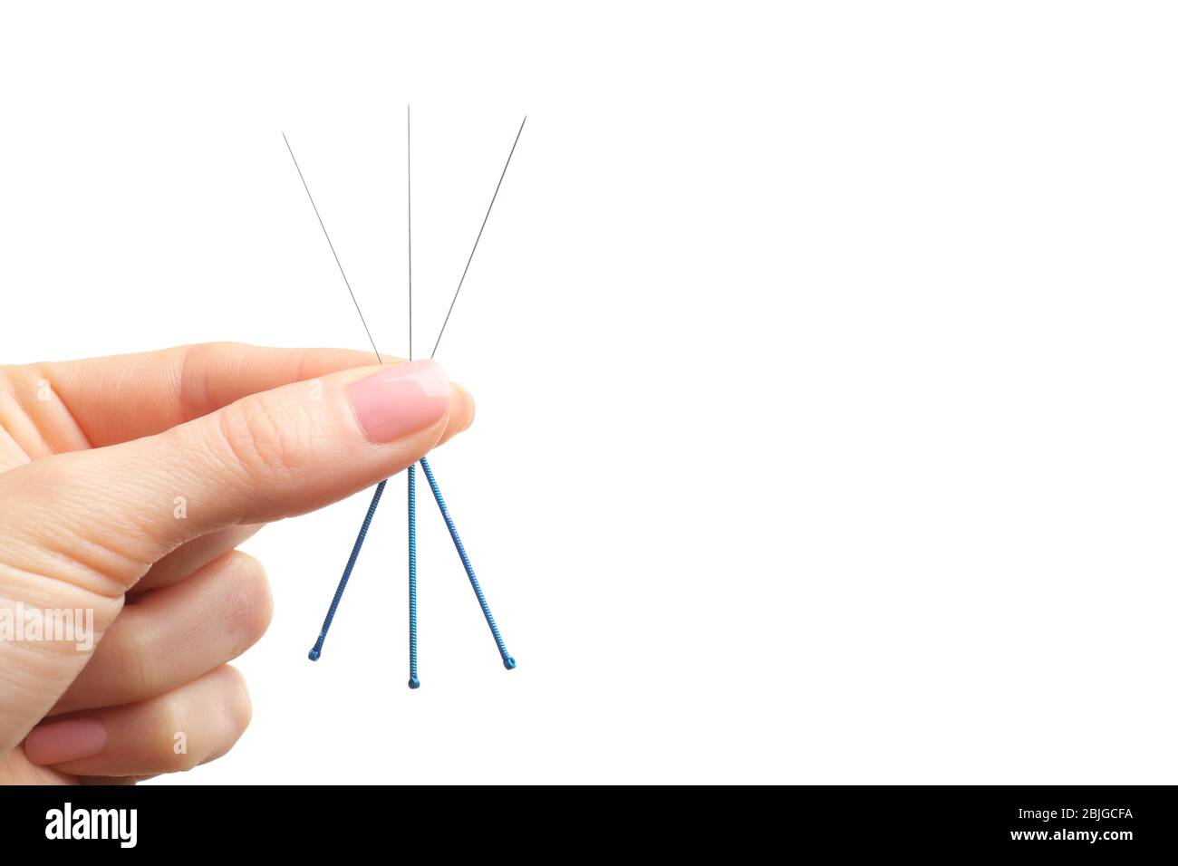 Female hand with needles for acupuncture on white background Stock ...