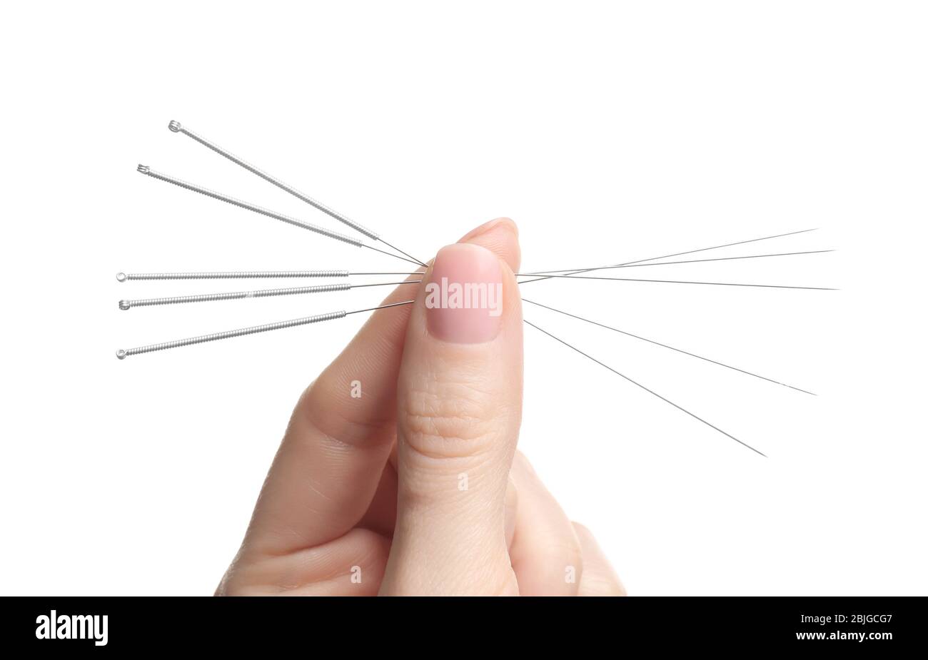 Female hand with needles for acupuncture on white background, closeup ...
