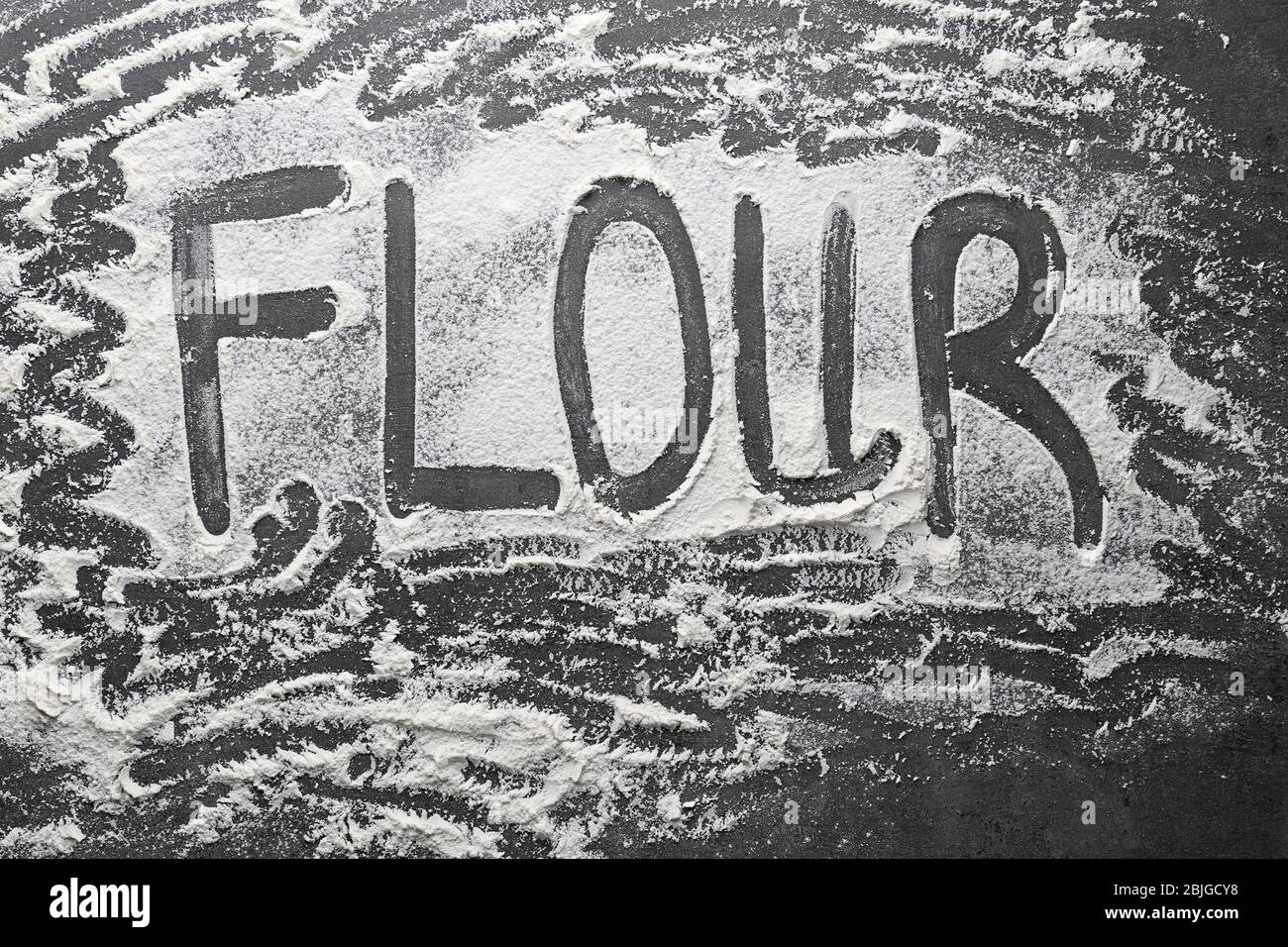 Word made of flour on dark table Stock Photo - Alamy