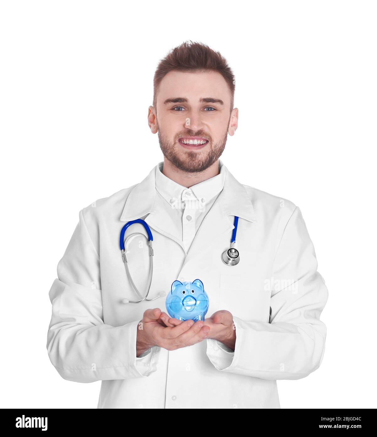 Happy young doctor holding piggy bank on white background Stock Photo ...
