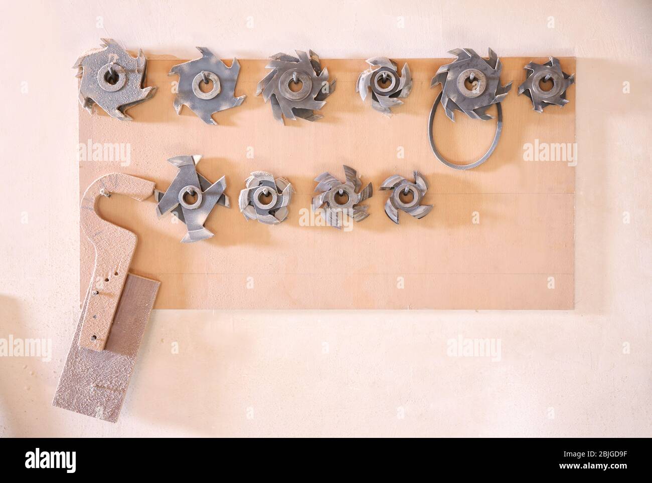 Stand with milling cutters on wall in carpenter's workshop Stock Photo ...