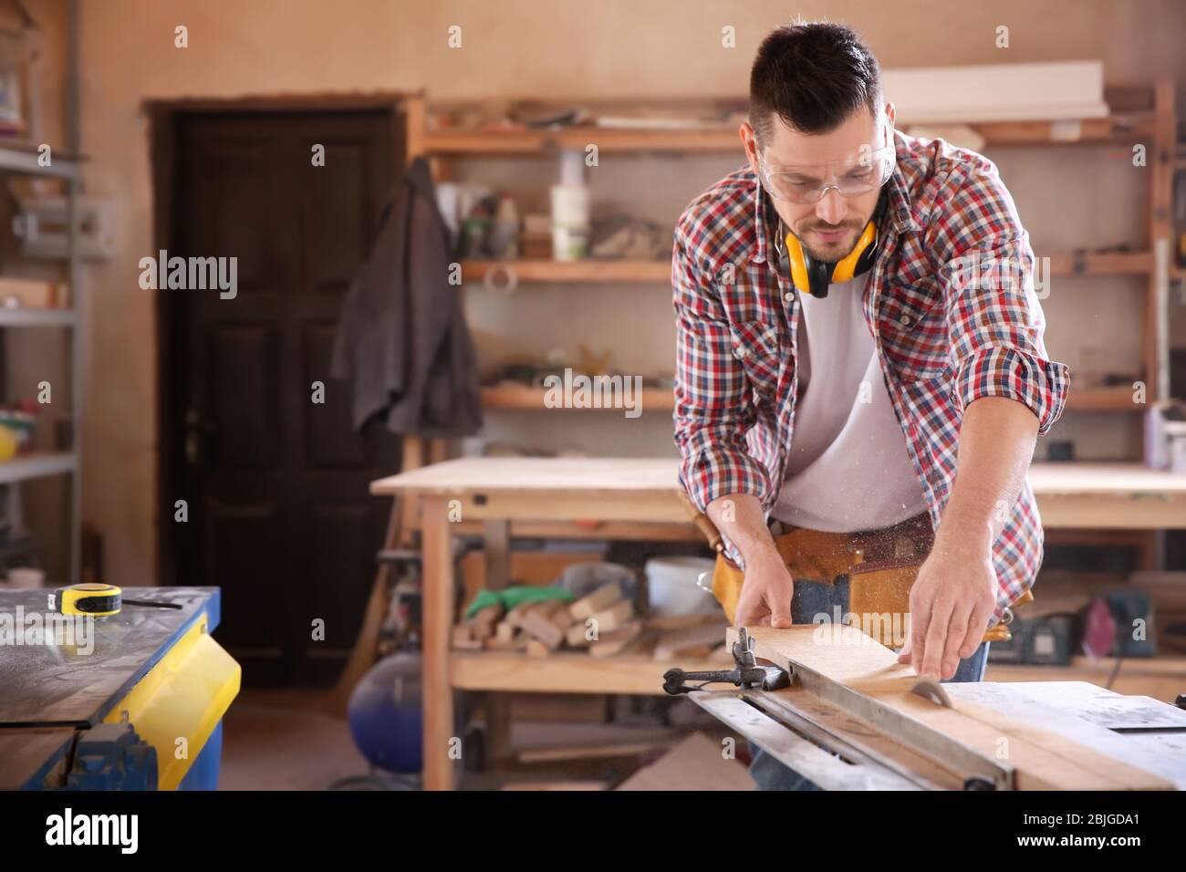 Carpenter sawing wood create hi-res stock photography and images - Alamy