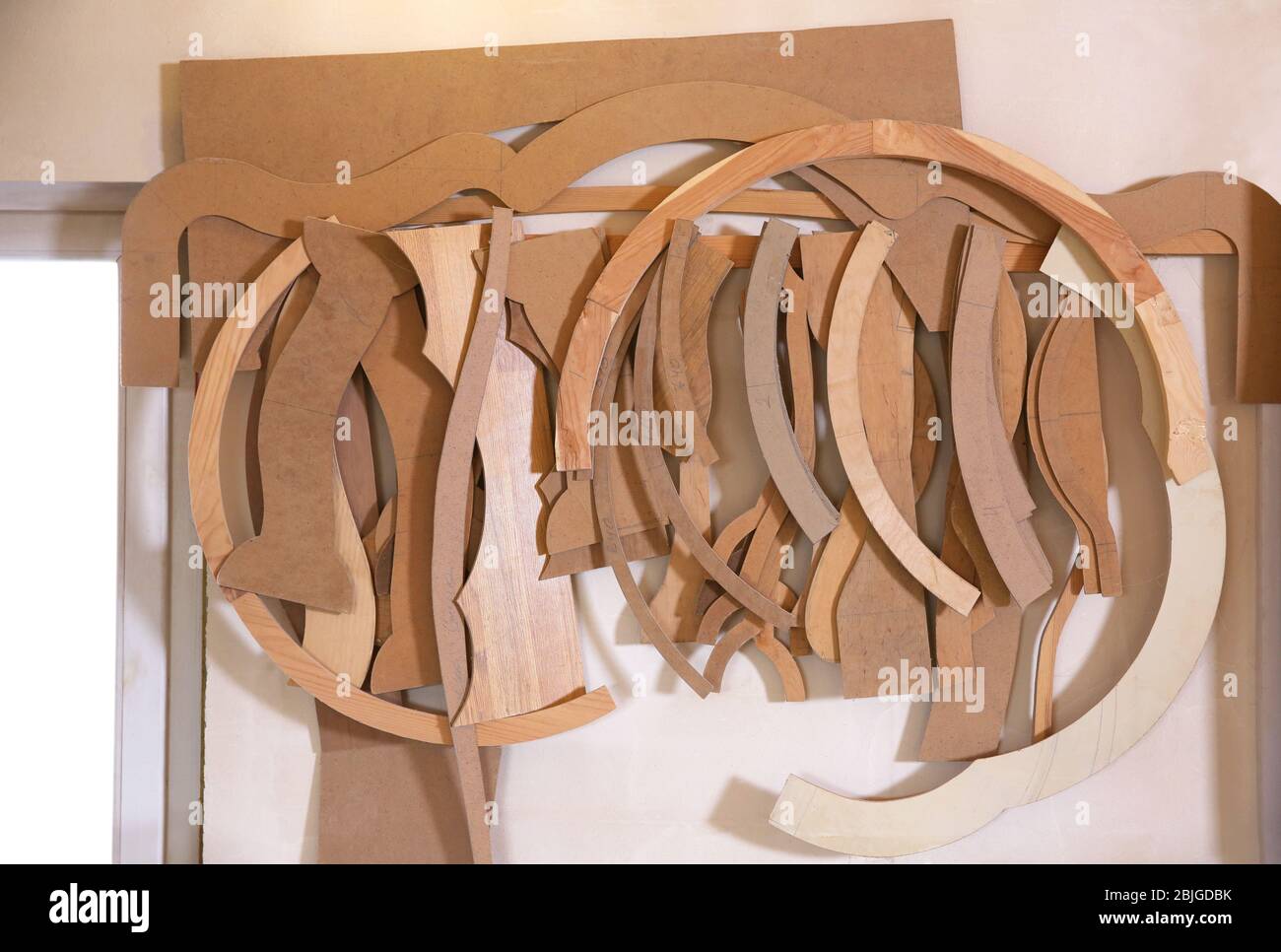Wooden mock-up models on wall in carpenter's workshop Stock Photo - Alamy